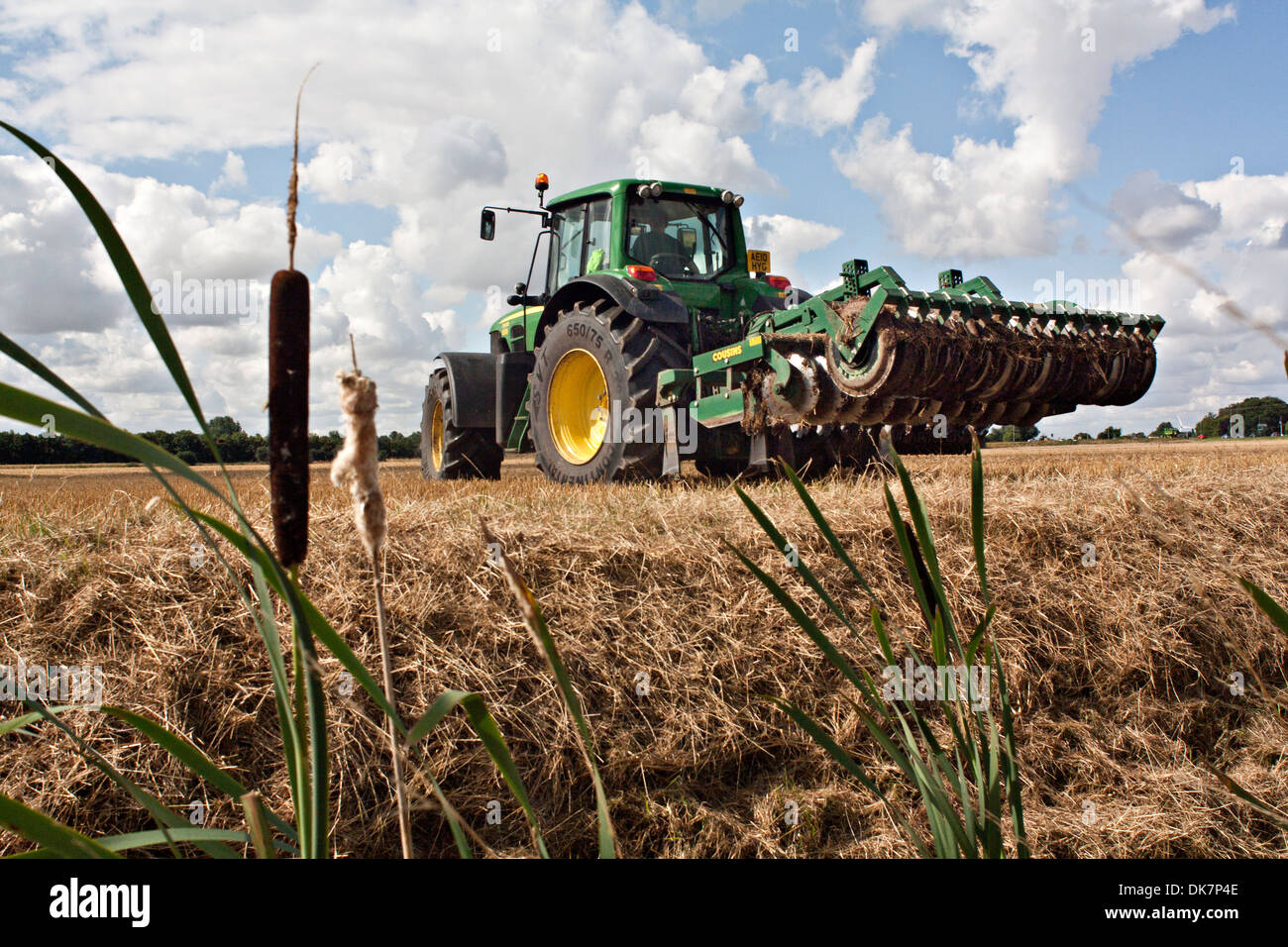 John Deere tractor harrowing Fenland field Stock Photo - Alamy