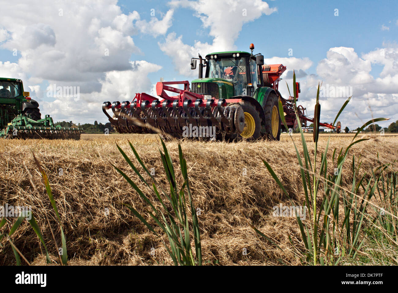 John Deere tractor harrowing Fenland field Stock Photo - Alamy