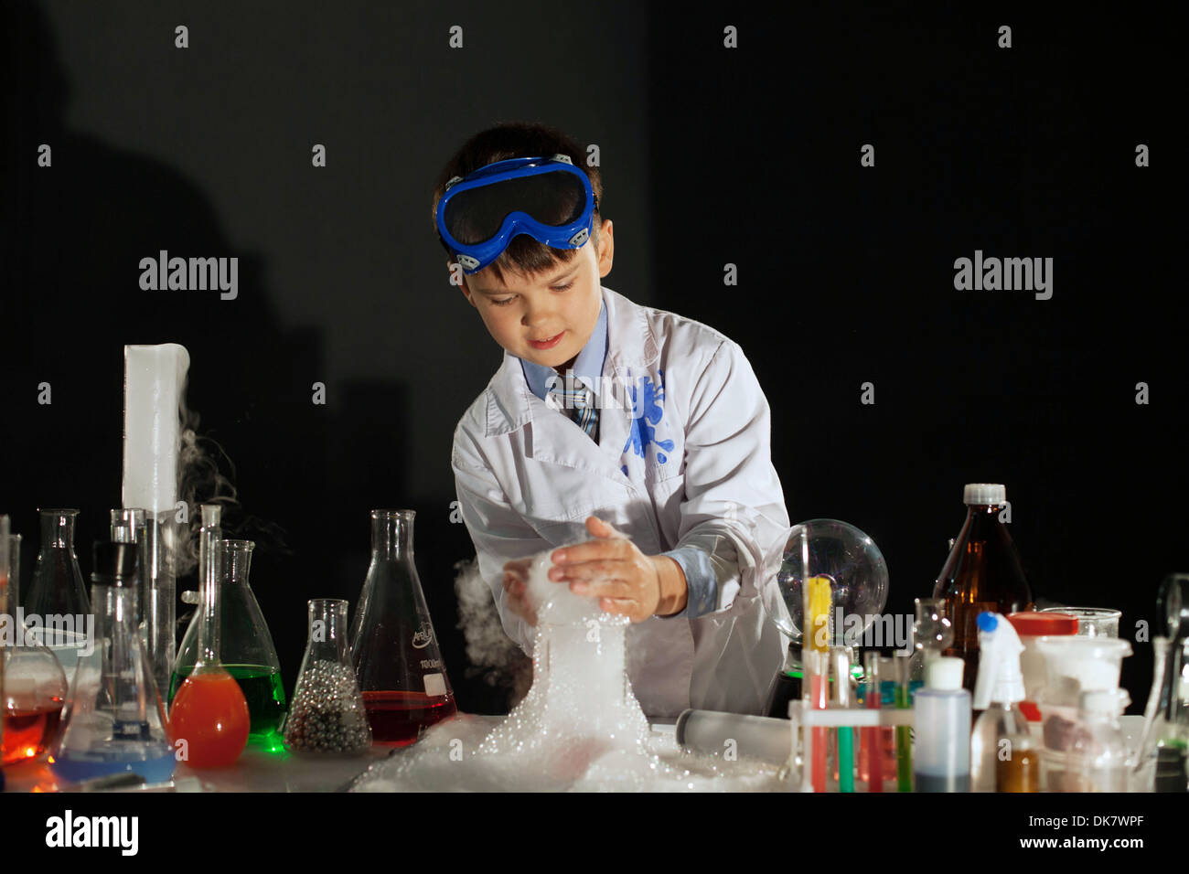 Image of little scientist watching experiment Stock Photo - Alamy