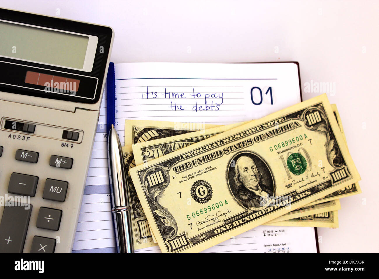 dollar bank notes, calculator, some tables and pen Stock Photo - Alamy