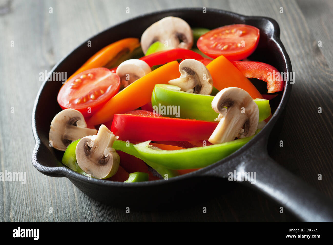 colorful vegetables in black pan ready for frying Stock Photo - Alamy