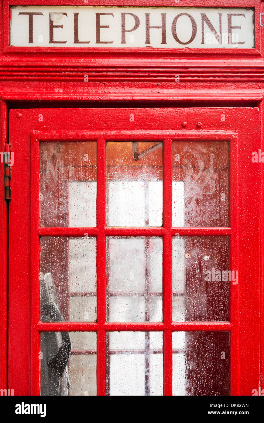 Red Phone cabine in London. Vintage phone cabine monumental.Rainy day ...