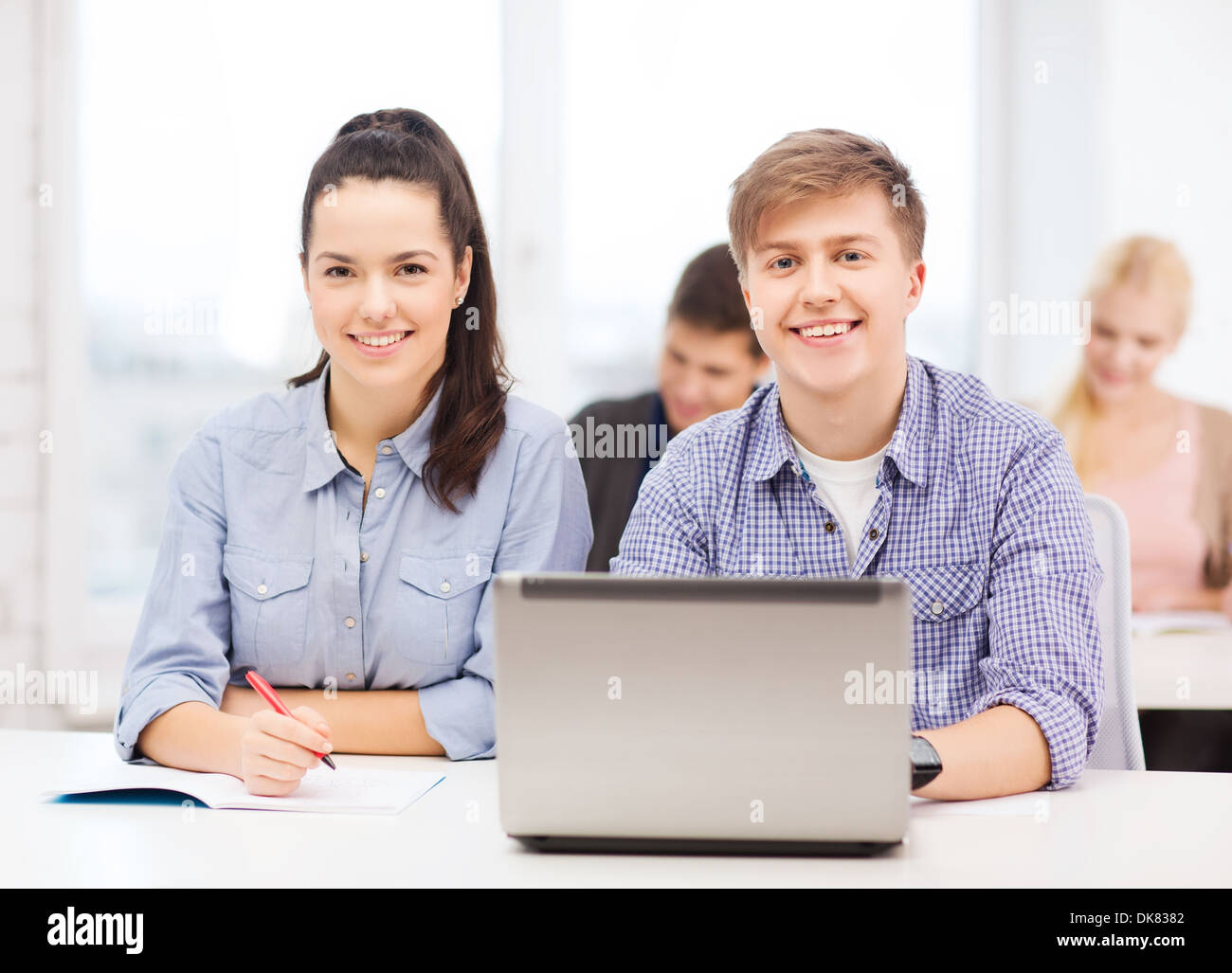 students with laptop and notebooks at school Stock Photo - Alamy