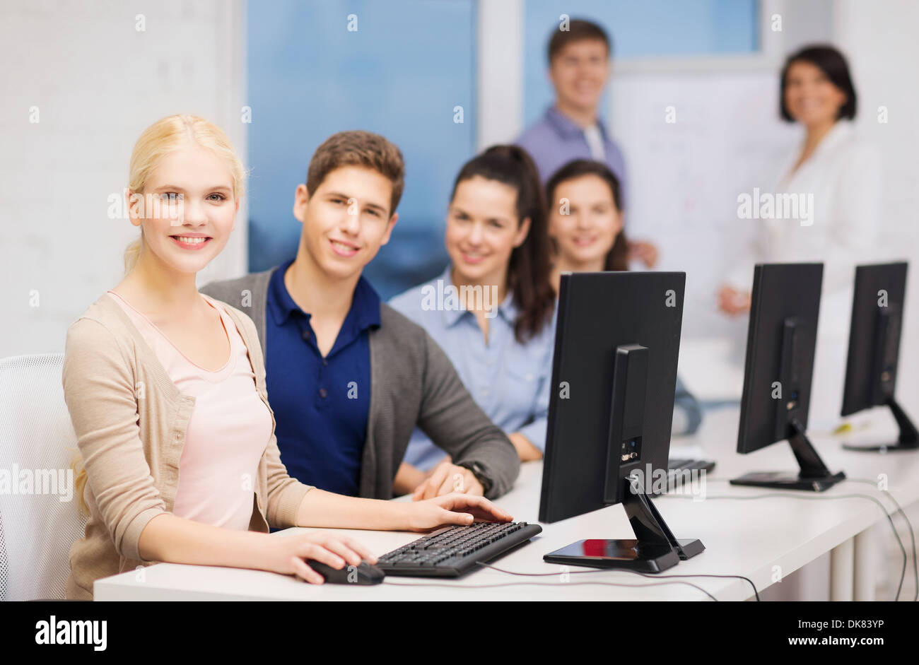 students with computer monitor at school Stock Photo - Alamy