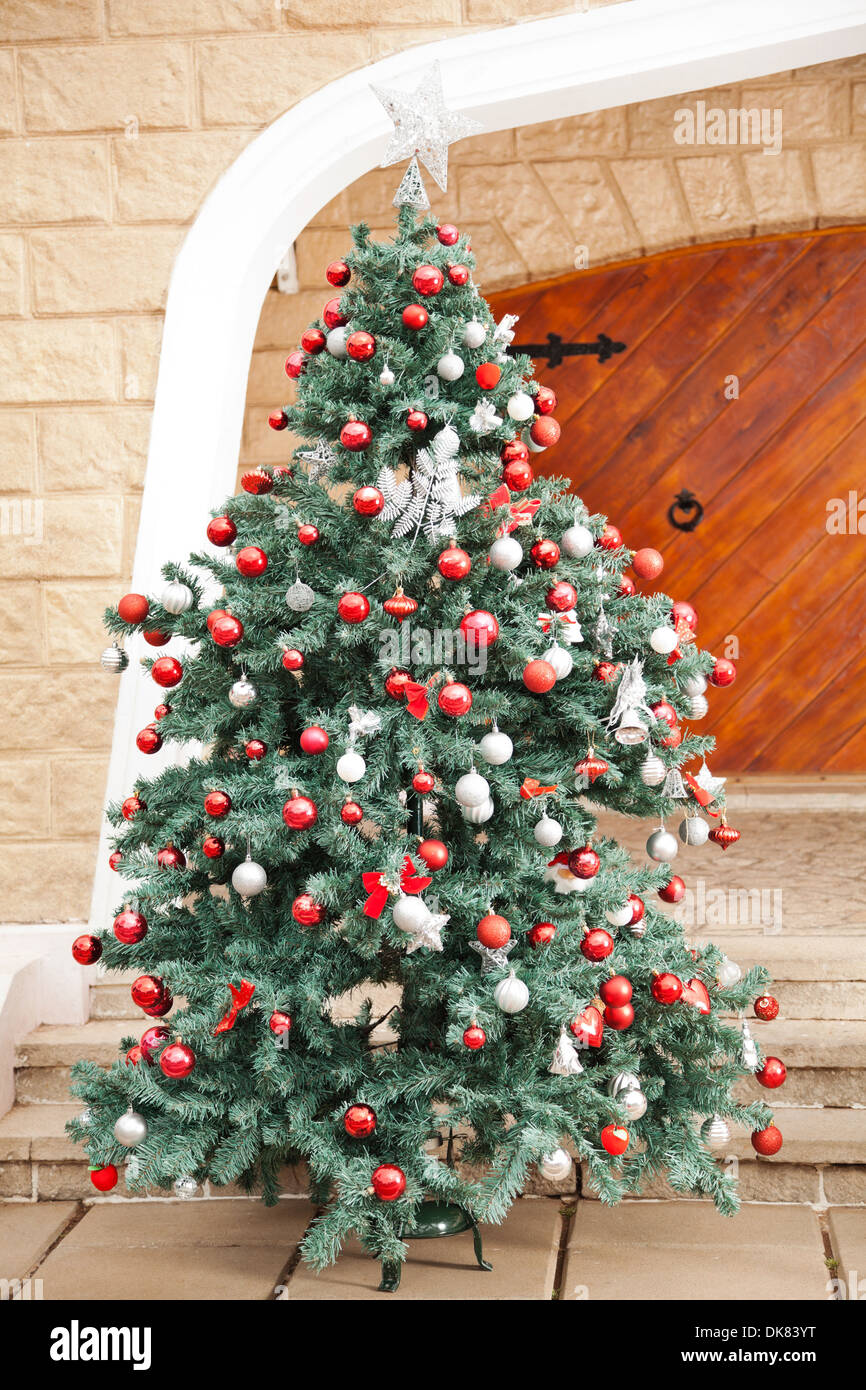 Christmas Tree In Front Of House Stock Photo - Alamy