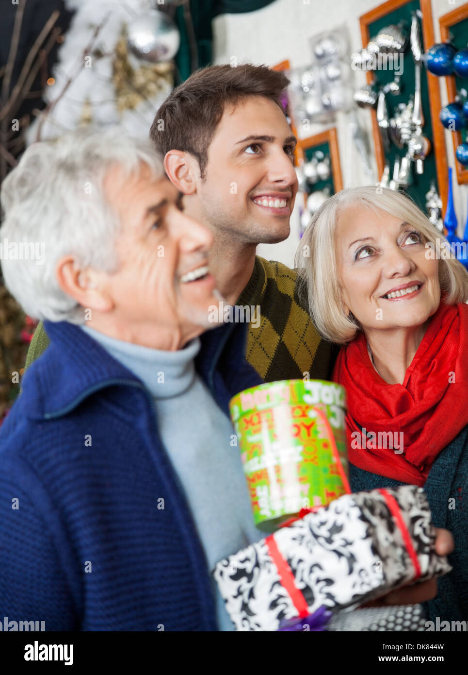 Happy Family Shopping In Christmas Store Stock Photo - Alamy
