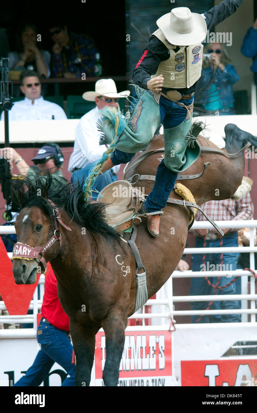 July 9, 2011 - Calgary, Alberta, Canada - Saddle bronc rider Dustin ...