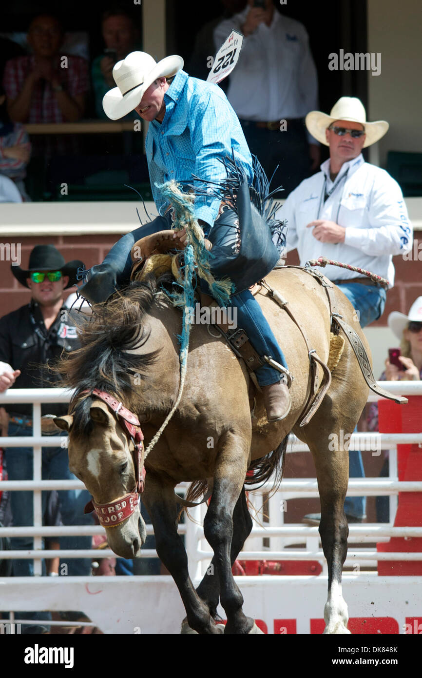 July 9, 2011 - Calgary, Alberta, Canada - Saddle bronc rider Tyler ...