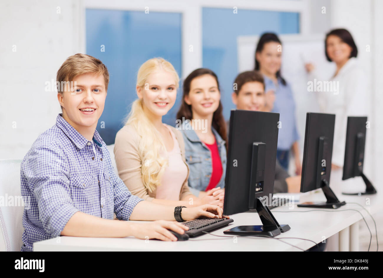 students with computer monitor at school Stock Photo - Alamy