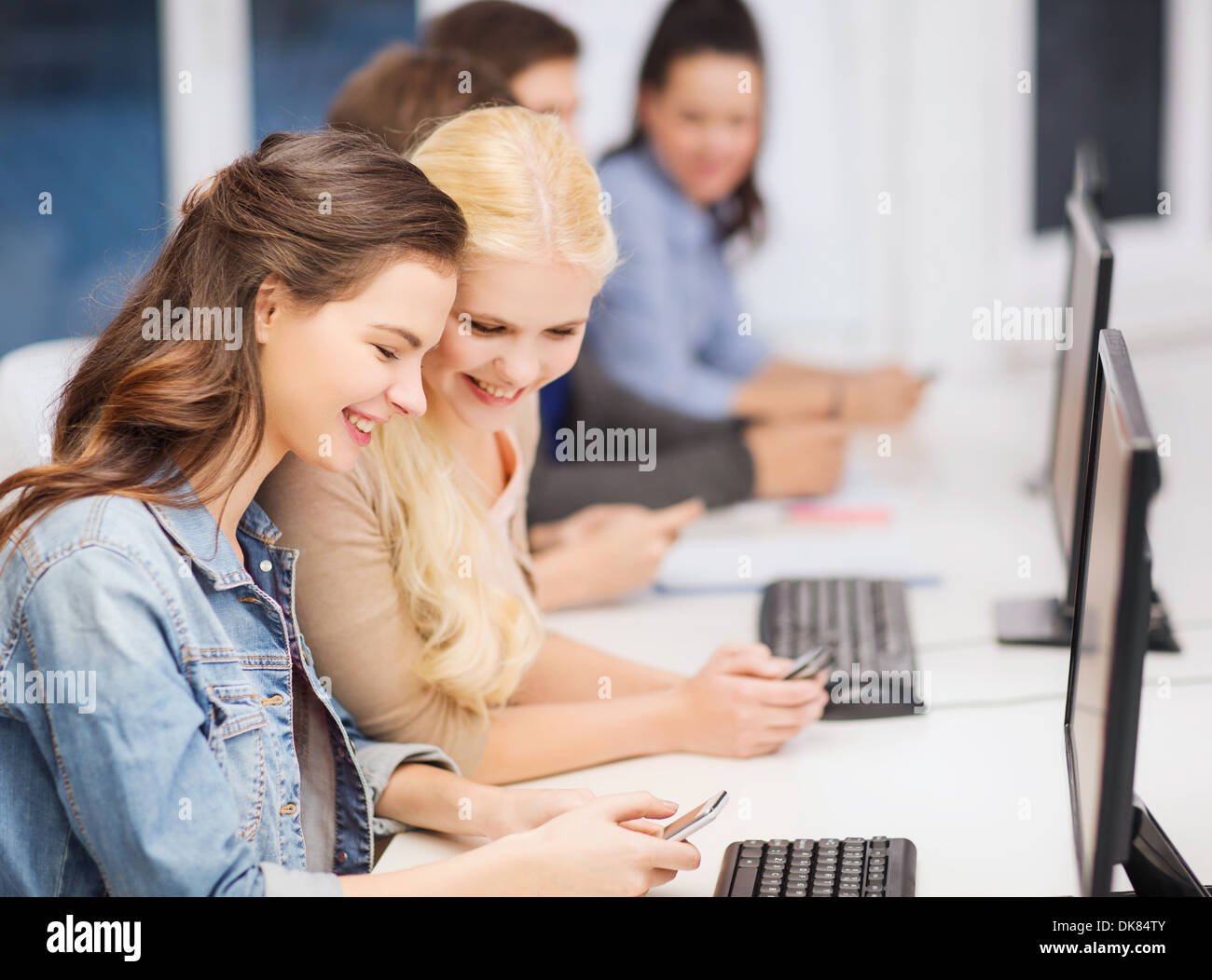 students with computer monitor and smartphones Stock Photo - Alamy