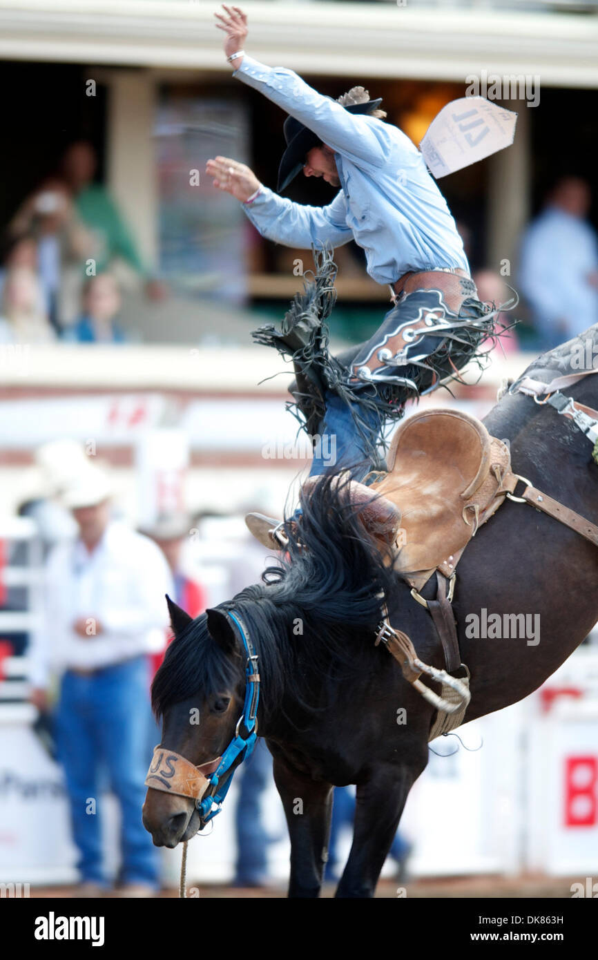 July 10, 2011 - Calgary, Alberta, Canada - Saddle bronc rider Wade ...