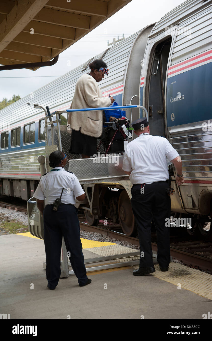 Conductor helping passenger train hi-res stock photography and images ...