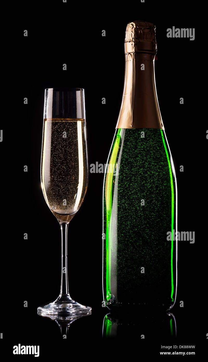 Celebratory golden champagne on a black background Stock Photo - Alamy
