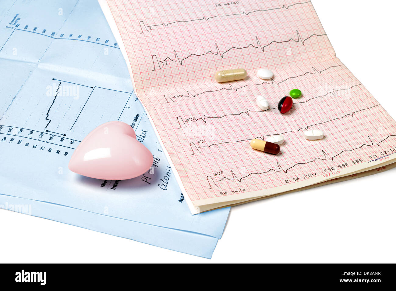 Electrocardiogram, tablets and heart on white Stock Photo - Alamy