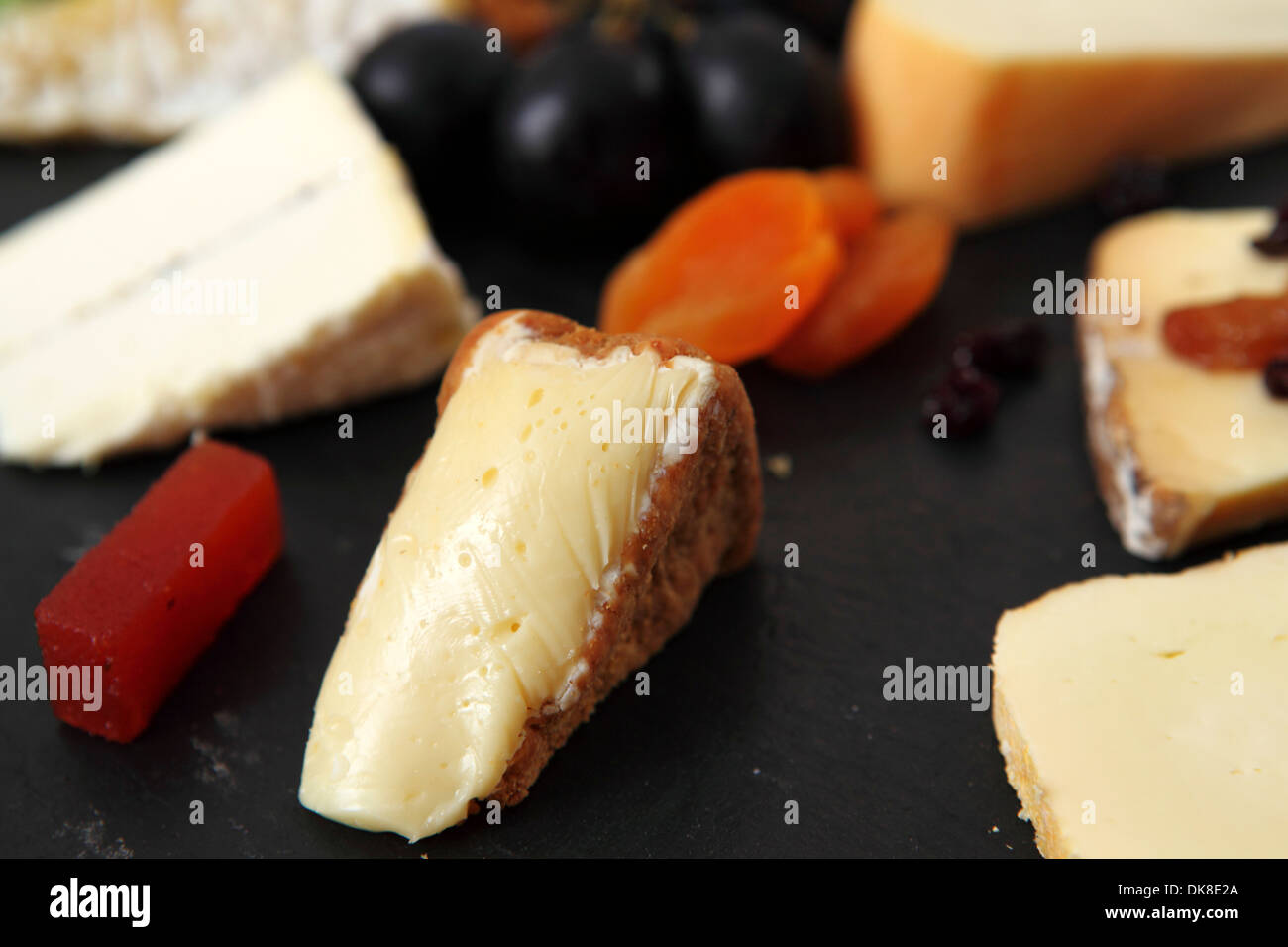 A cheese platter with a selection of Continental cheeses. Quince ...