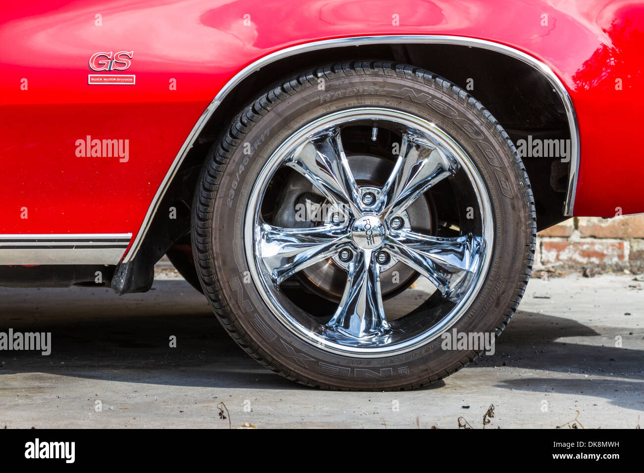 Stylish chrome wheel on red Buick classic muscle car Stock Photo - Alamy