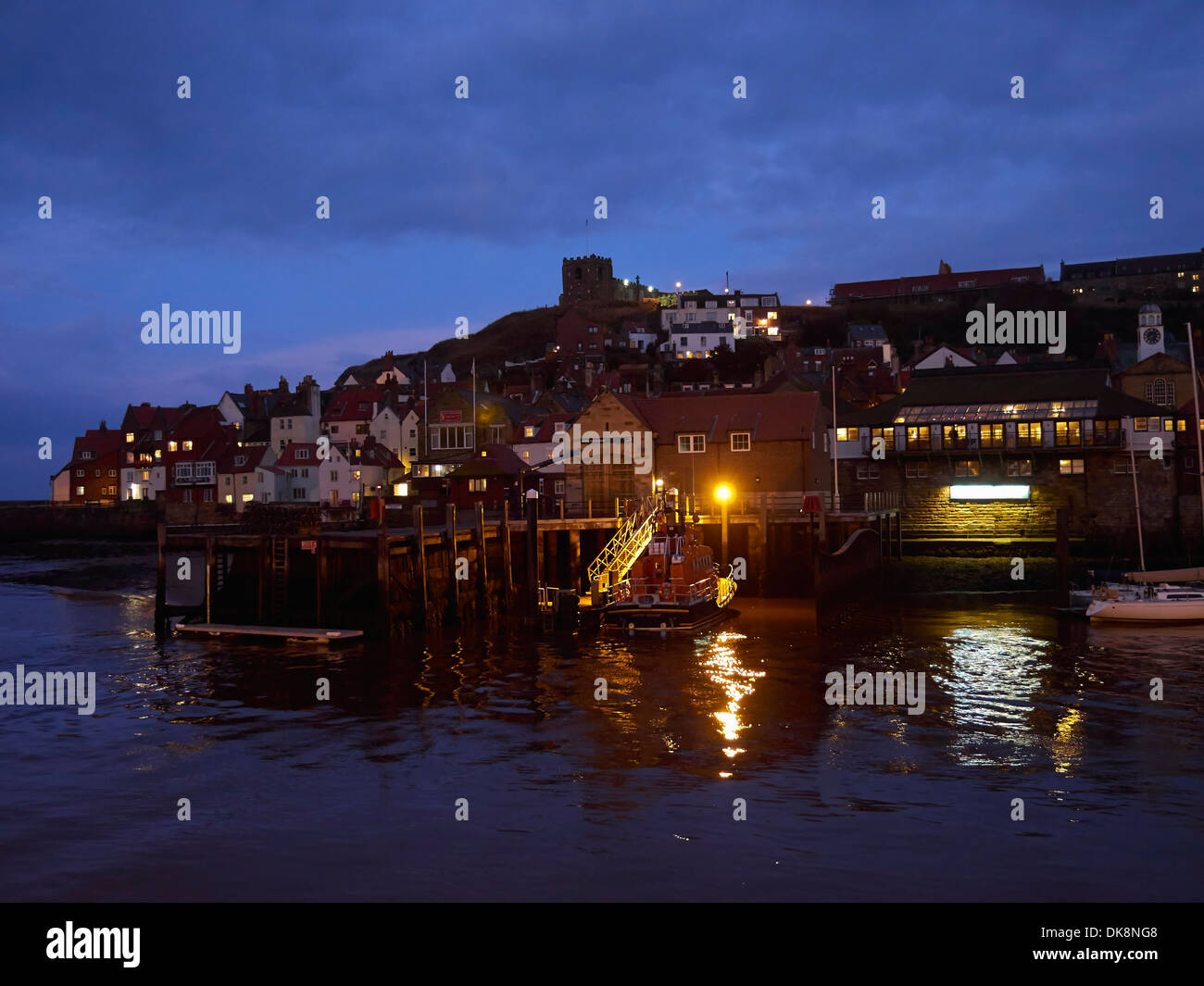 Whitby Lower Harbour and the RNLI Lifeboat Station at night Stock Photo ...