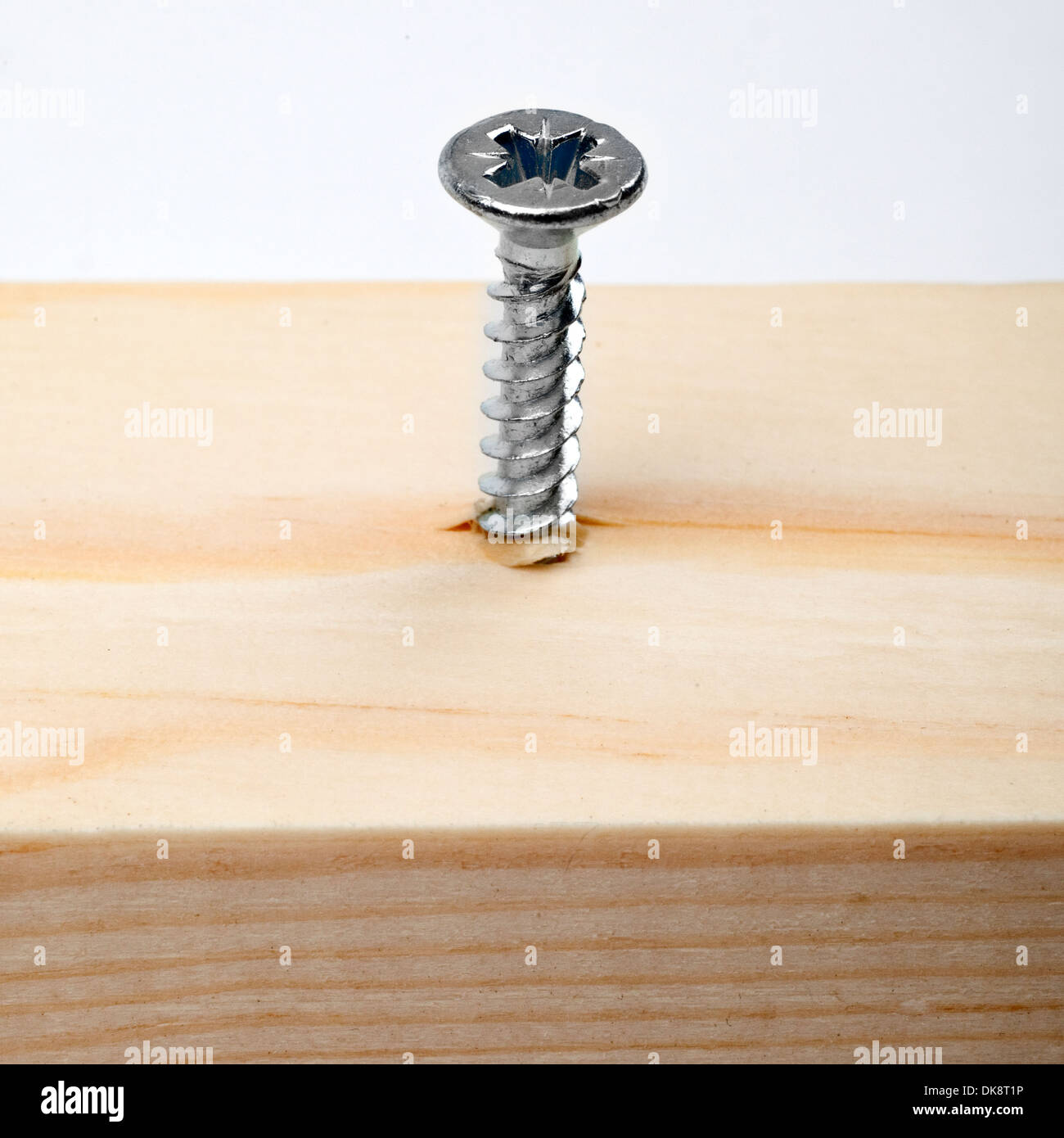 Screw in a piece of wood Stock Photo - Alamy