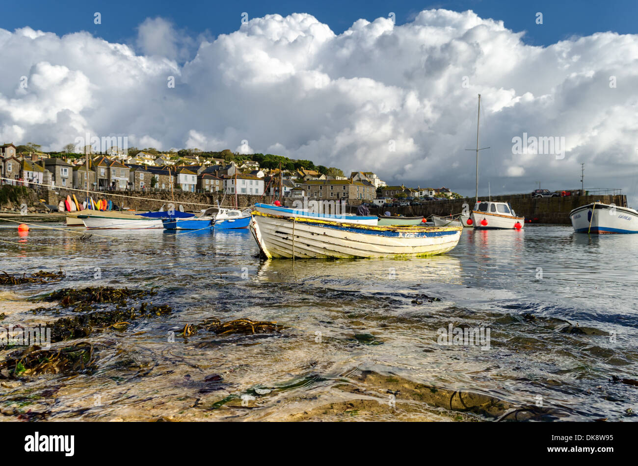 Boats moored in Mousehole Harbor. Mousehole, Cornwall, England Stock ...