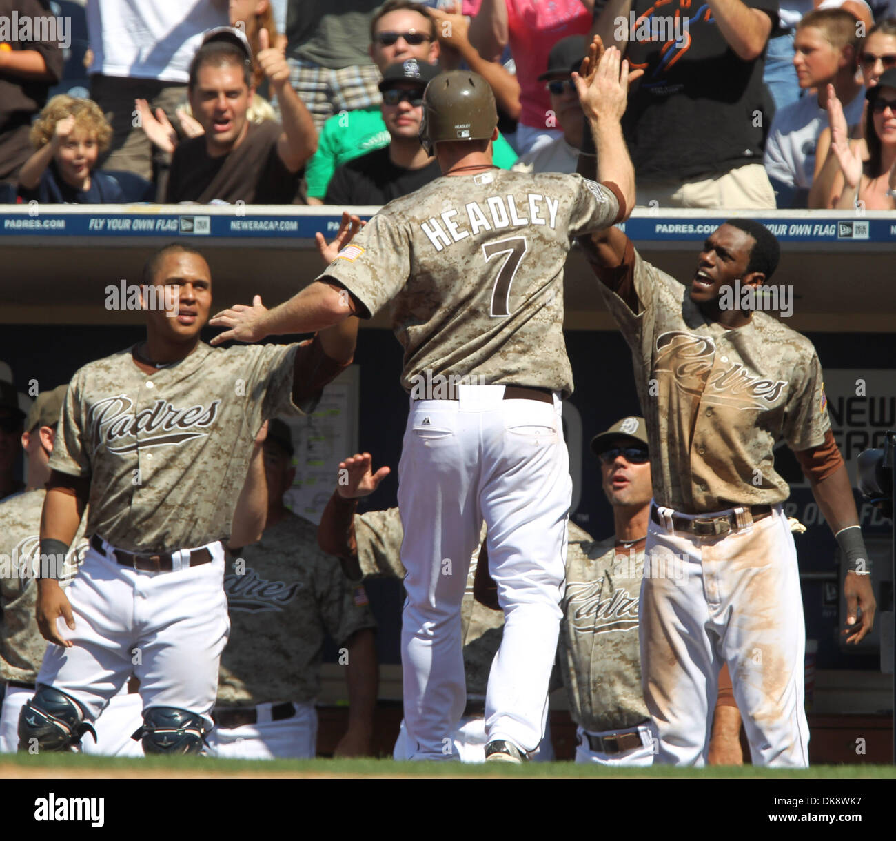 July 31, 2011 - The Padres' Chase Headley is greeted by Cameron Maybin ...