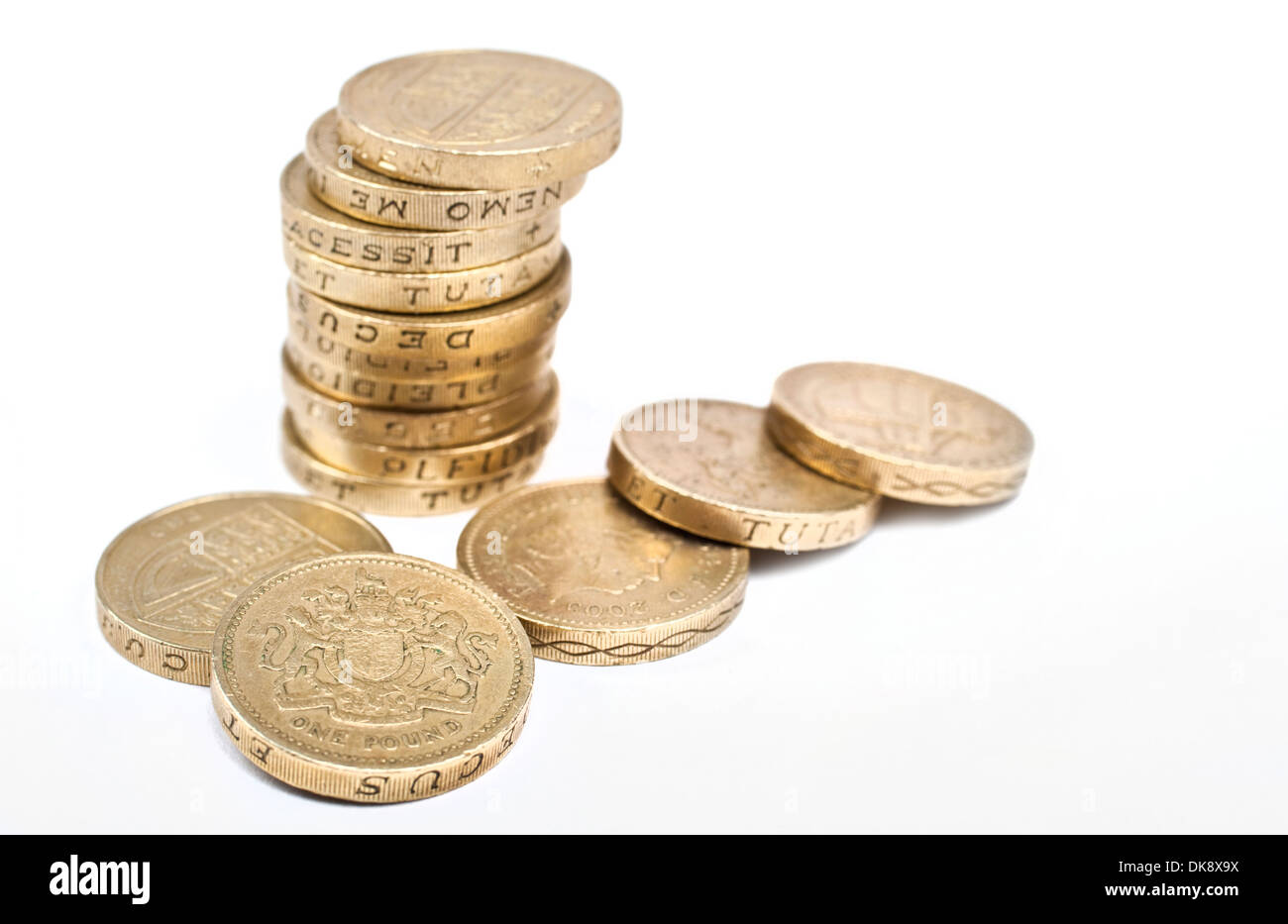 One Pound coins on a white background Stock Photo - Alamy