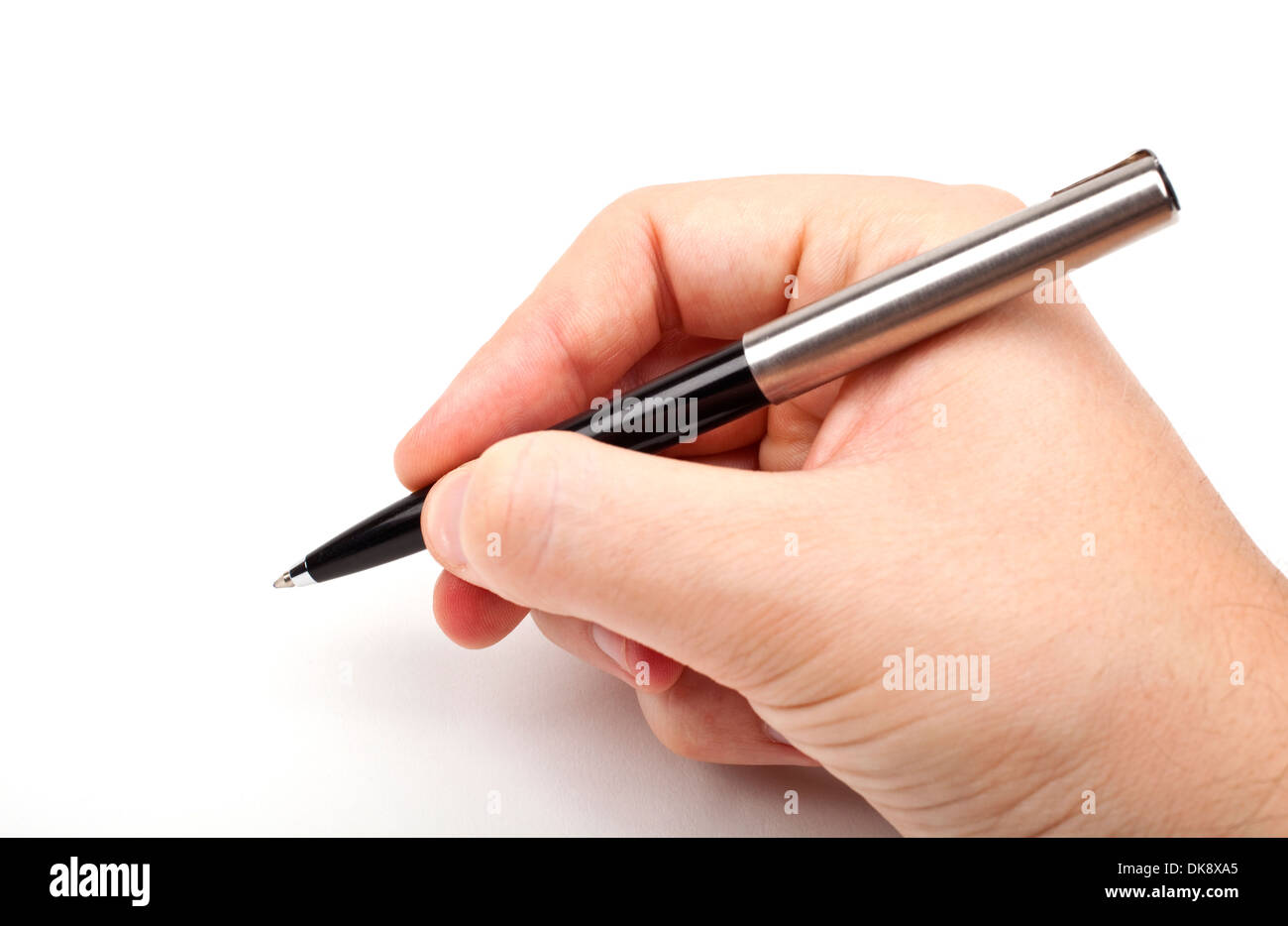 Hand holding a pen in the writing position Stock Photo - Alamy