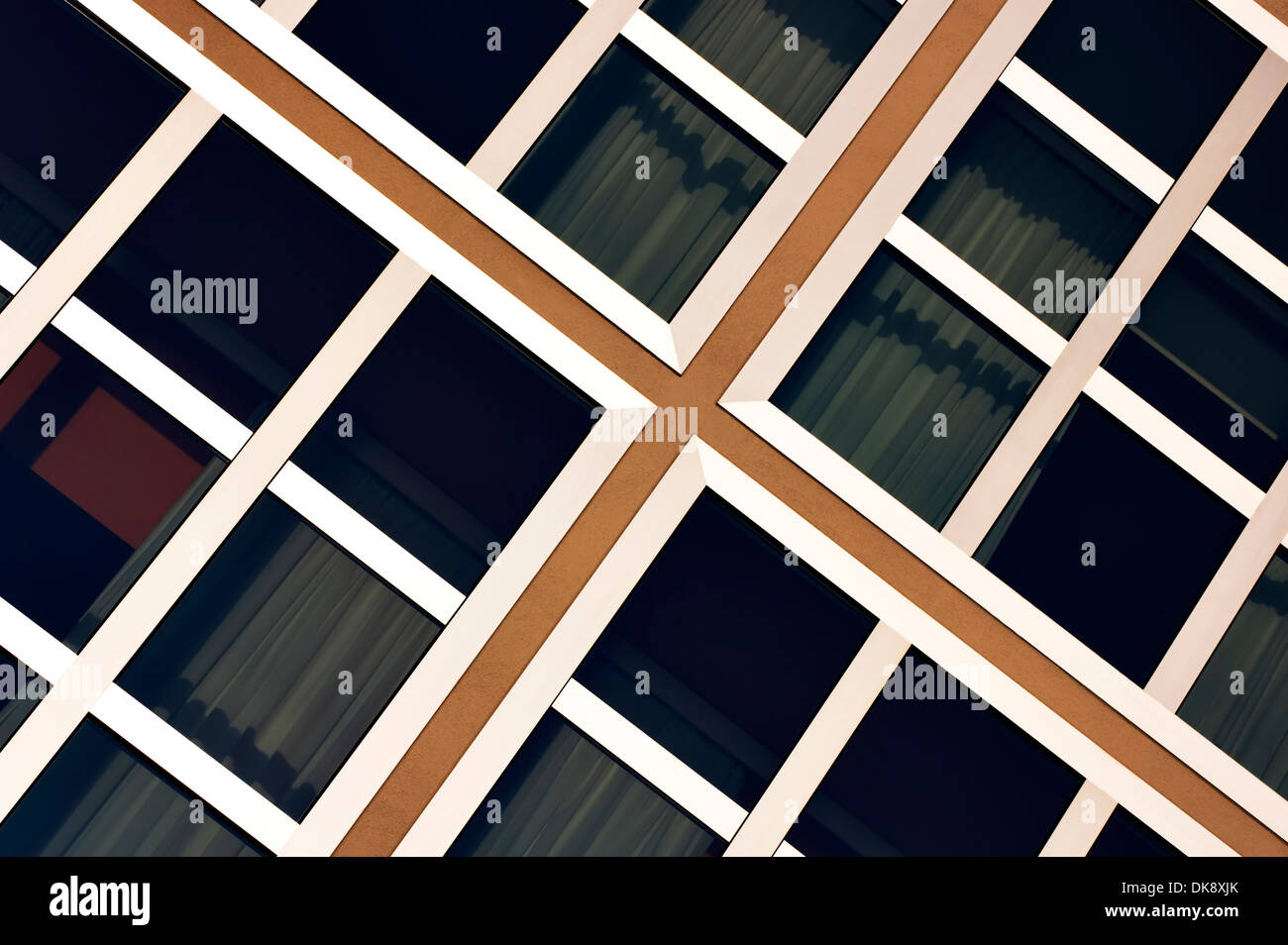 Glass wall with square windows in a building Stock Photo - Alamy