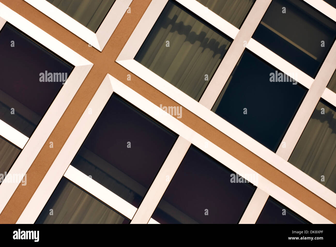 Glass wall with square windows in a building Stock Photo - Alamy