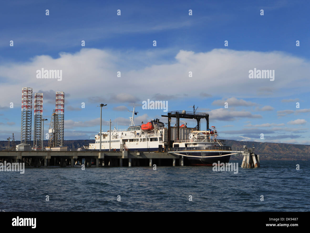 Alaskan Ferry at dock in Homer, Alaska with an oil jack up rig in the ...