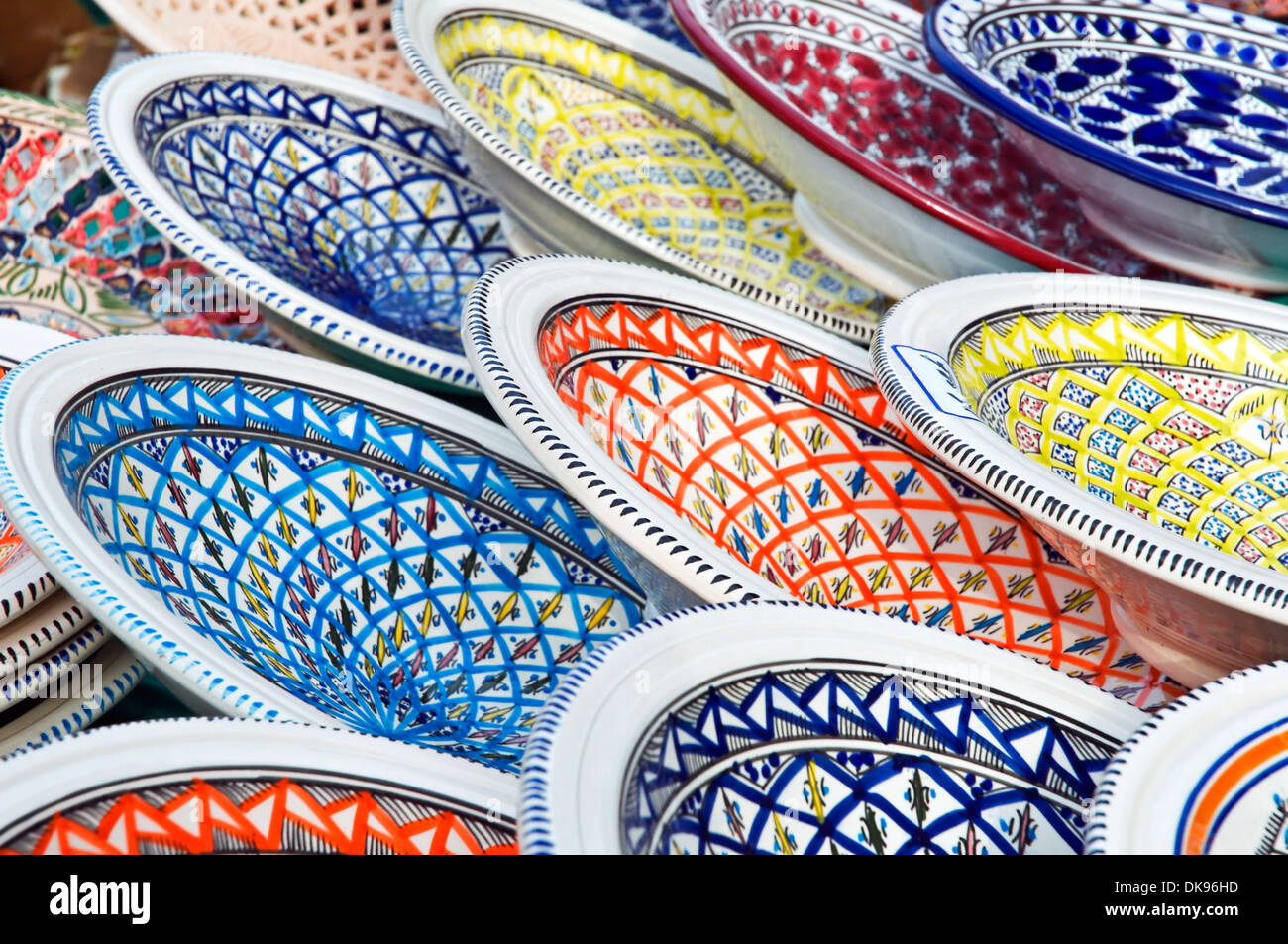 Typical handmade coloured dishes displayed in an exhibition Stock Photo ...
