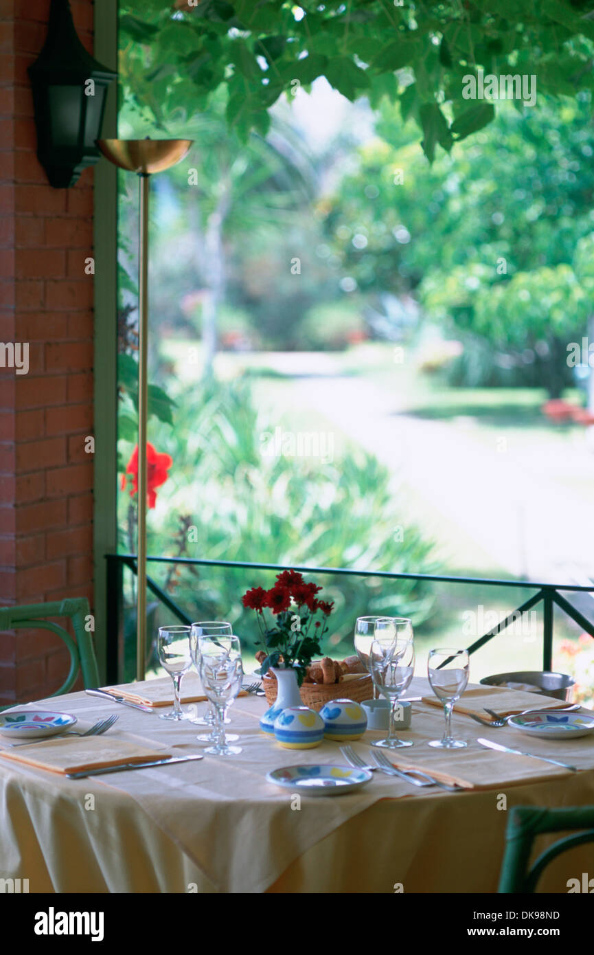 Restaurant table with a view of the garden Stock Photo - Alamy