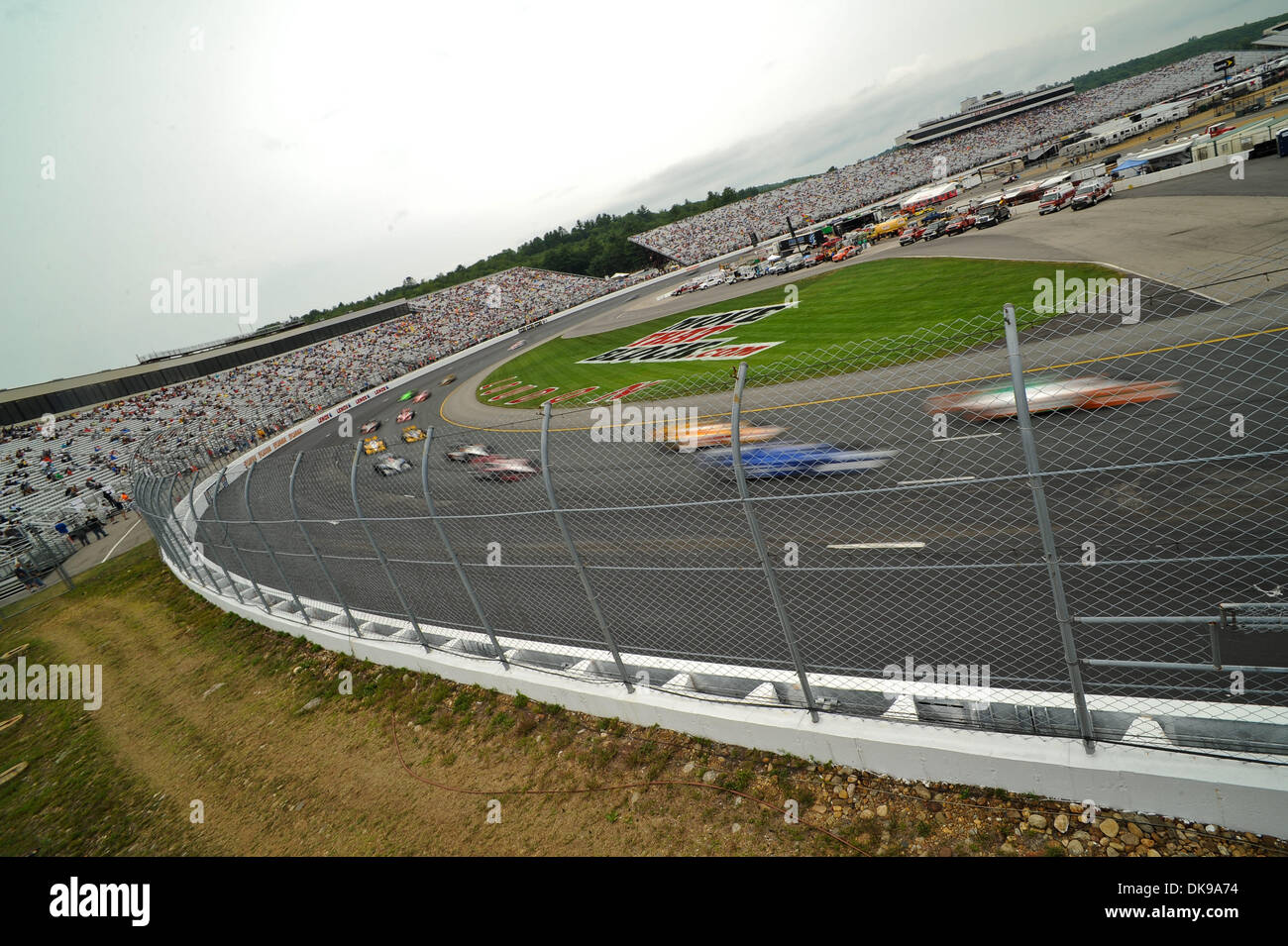 Aug. 14, 2011 - Loudon, New Hampshire, U.S - Indy cars exit turn 2 ...