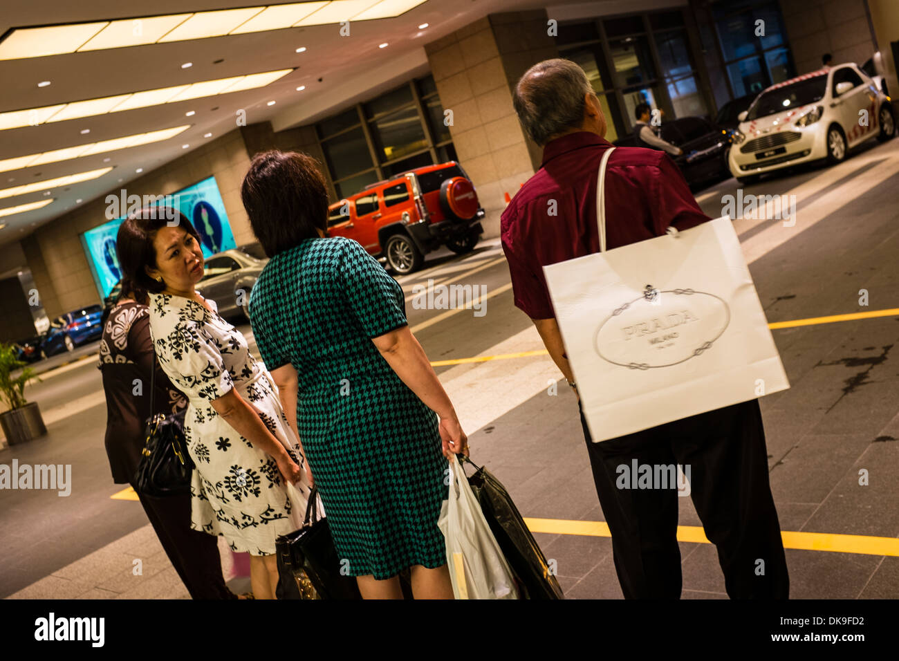 Shoppers wait for their car in the Pavilion shopping mall in Kuala ...