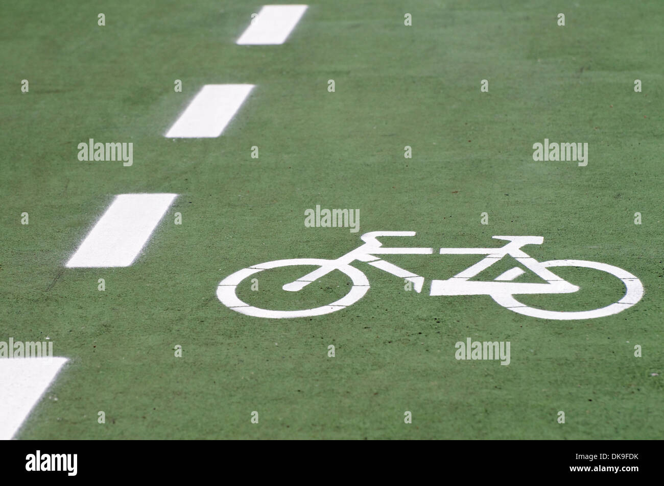 Bike route with painted bicycle symbol Stock Photo - Alamy
