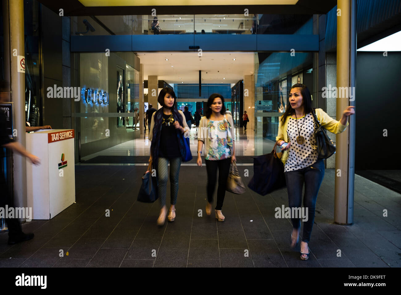Shoppers leave the Pavilion shopping mall in Kuala Lumpur Stock Photo ...