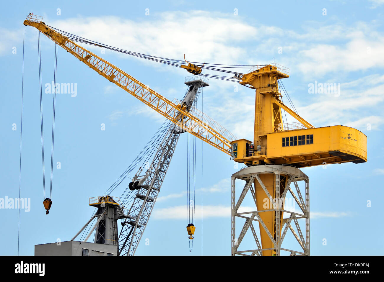 Two cranes in a dockyard Stock Photo - Alamy