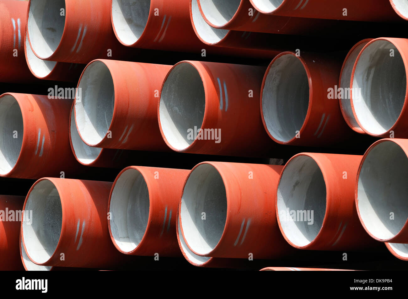 Stack of red pipes Stock Photo - Alamy