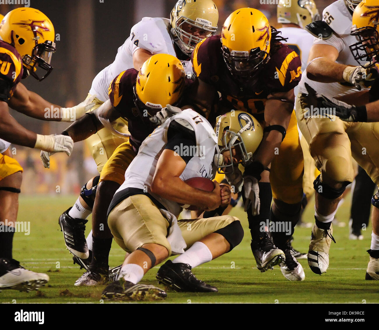 September 1, 2011: UC Davis quarterback Randy Wright #17 is sacked by ...