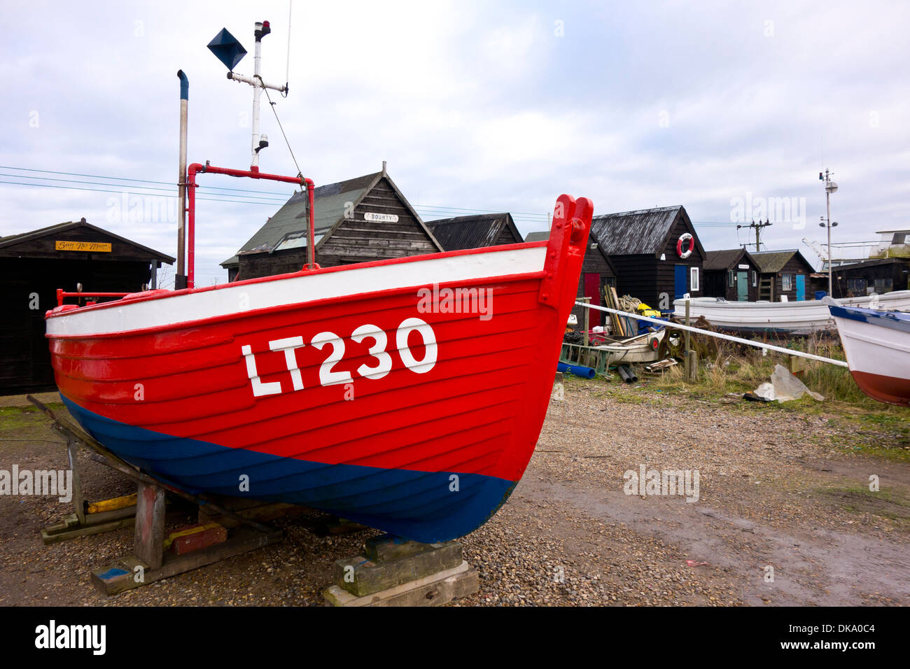 bright red small fishing boat Southwold harbour Stock Photo - Alamy