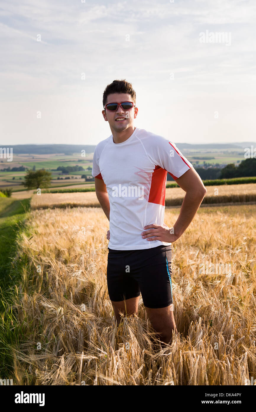 man jogging through the fields Stock Photo - Alamy