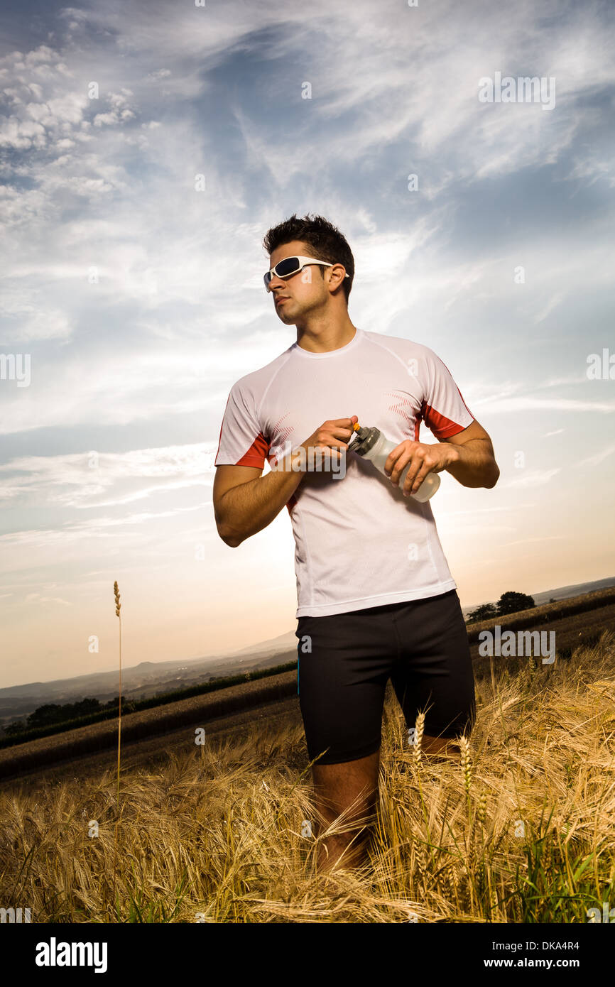 man jogging through the fields Stock Photo - Alamy