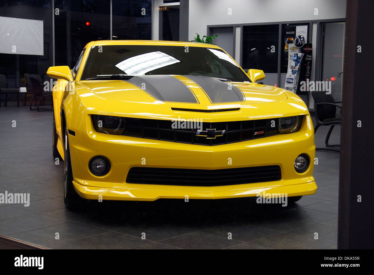 Yellow 2011 Chevrolet Camaro displayed at car dealership Stock Photo ...