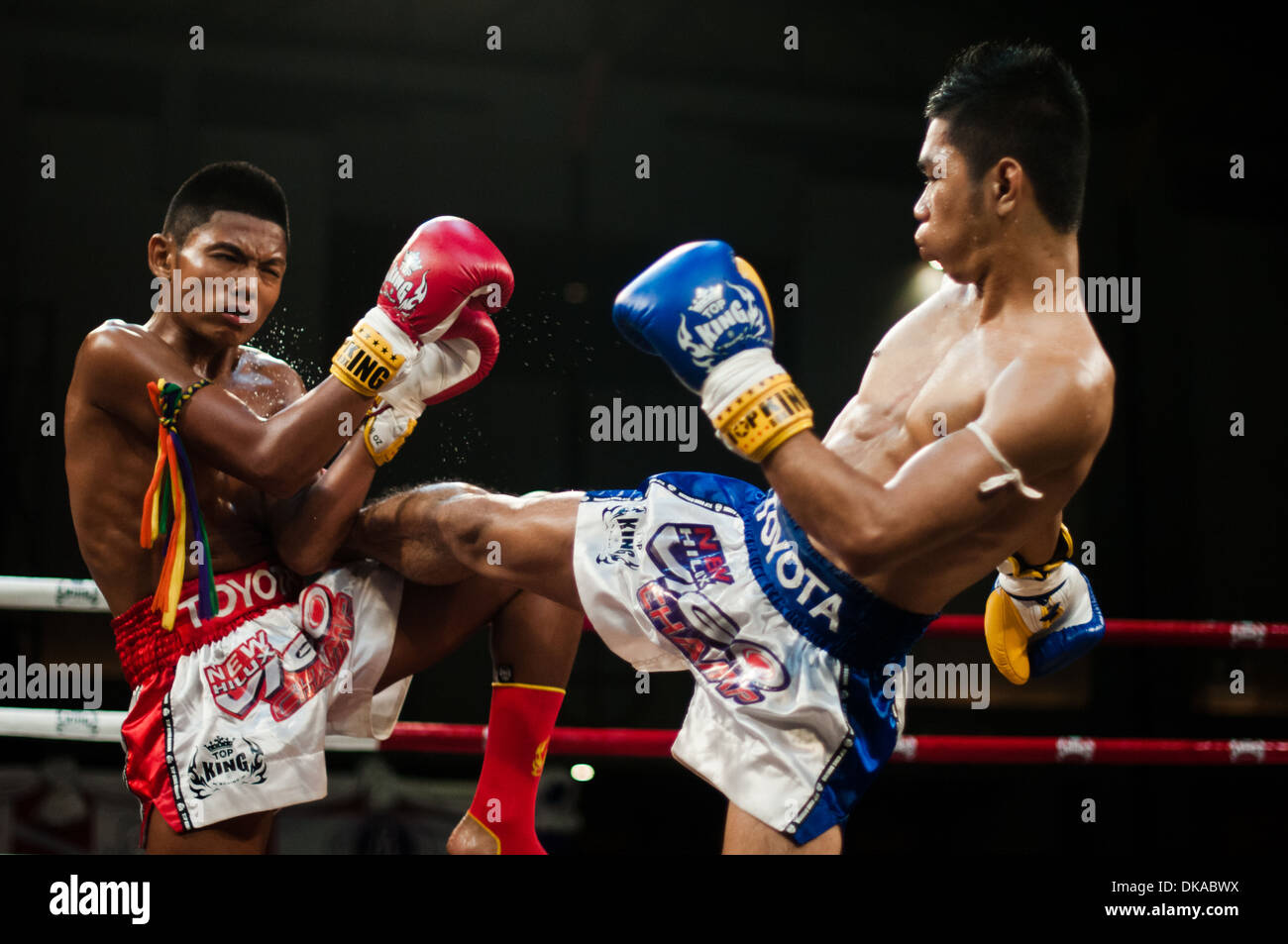 Thai fighter kicks his opponent in a Thai Boxing fight in Bangkok ...