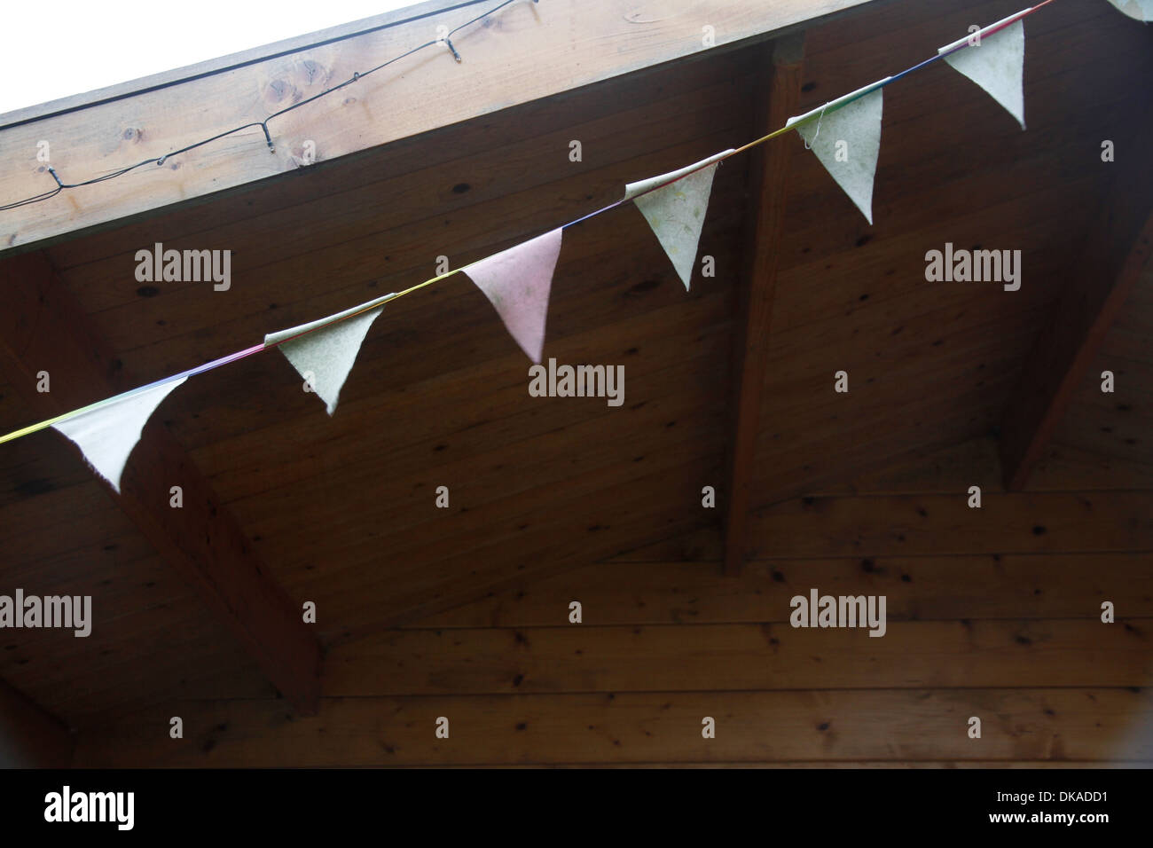 Bunting on a shed Stock Photo - Alamy