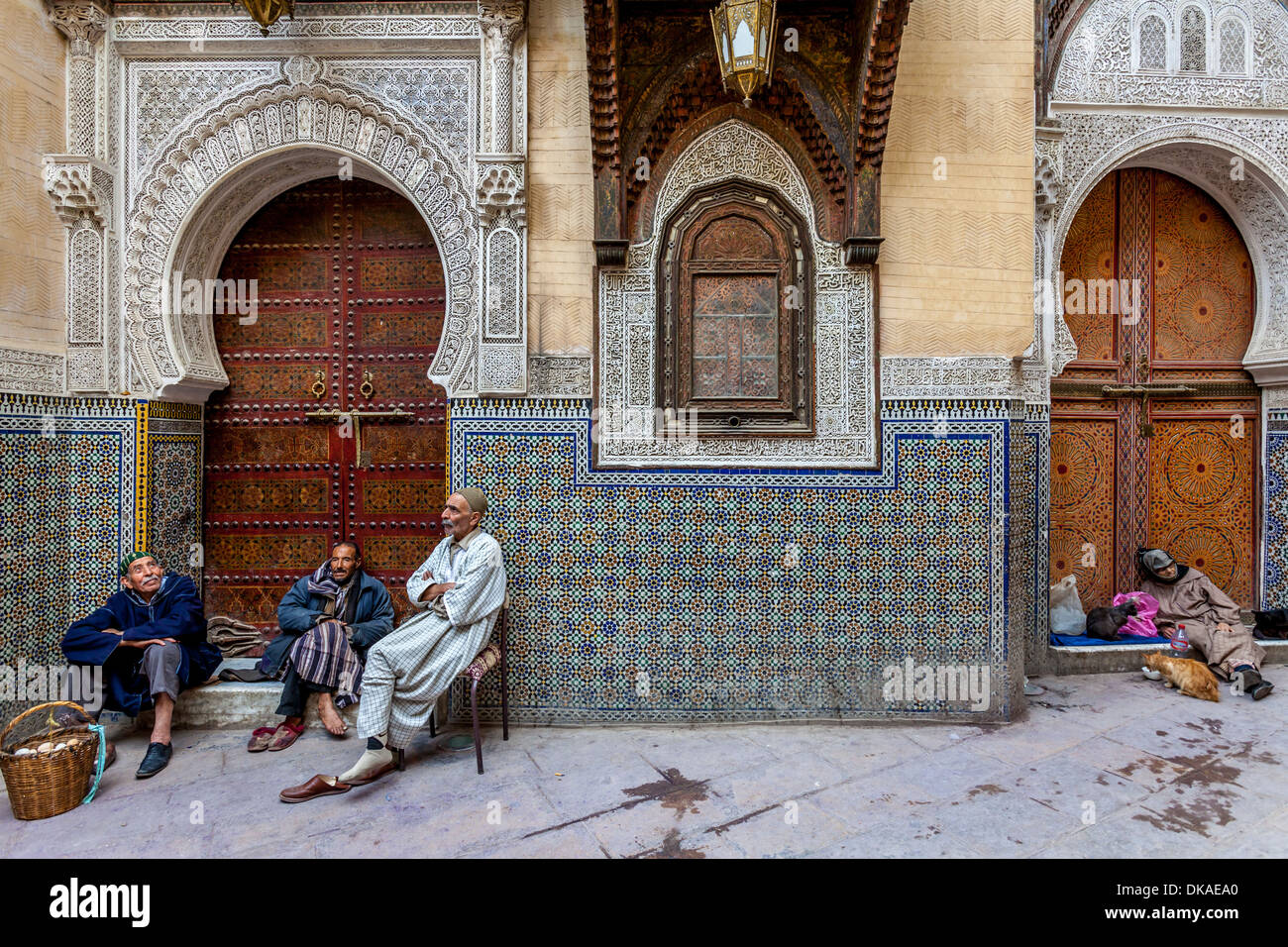 Men sitting outside Mosque Sidi Ahmed Tijani, The Medina, Fez, Morocco ...