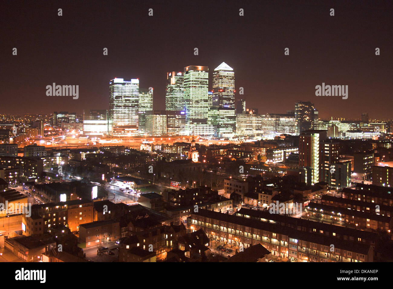 Night time aerial view over East London looking towards Canary Wharf ...