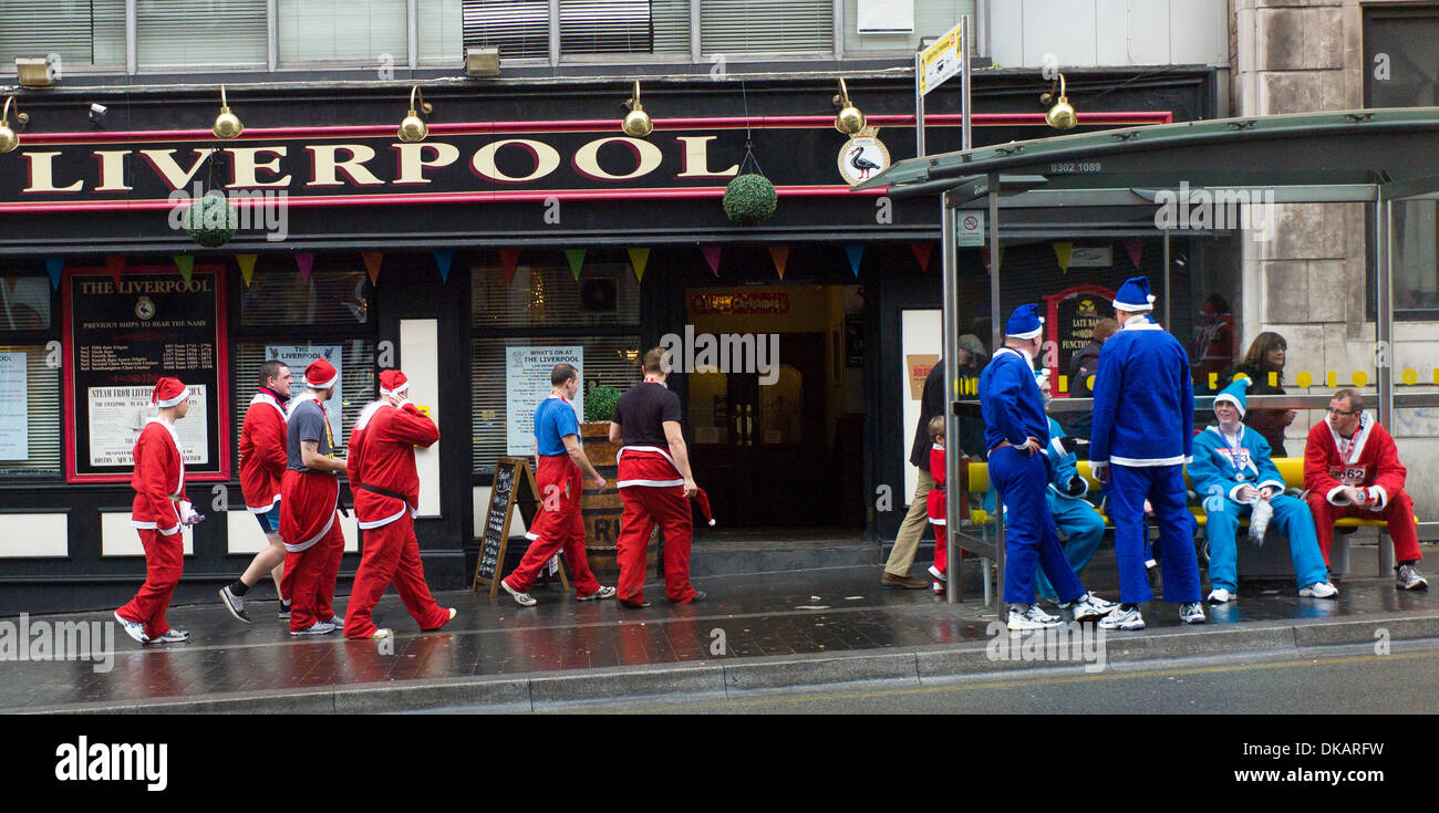 Charity Santa Dash in Liverpool runners head for the pub after the run ...