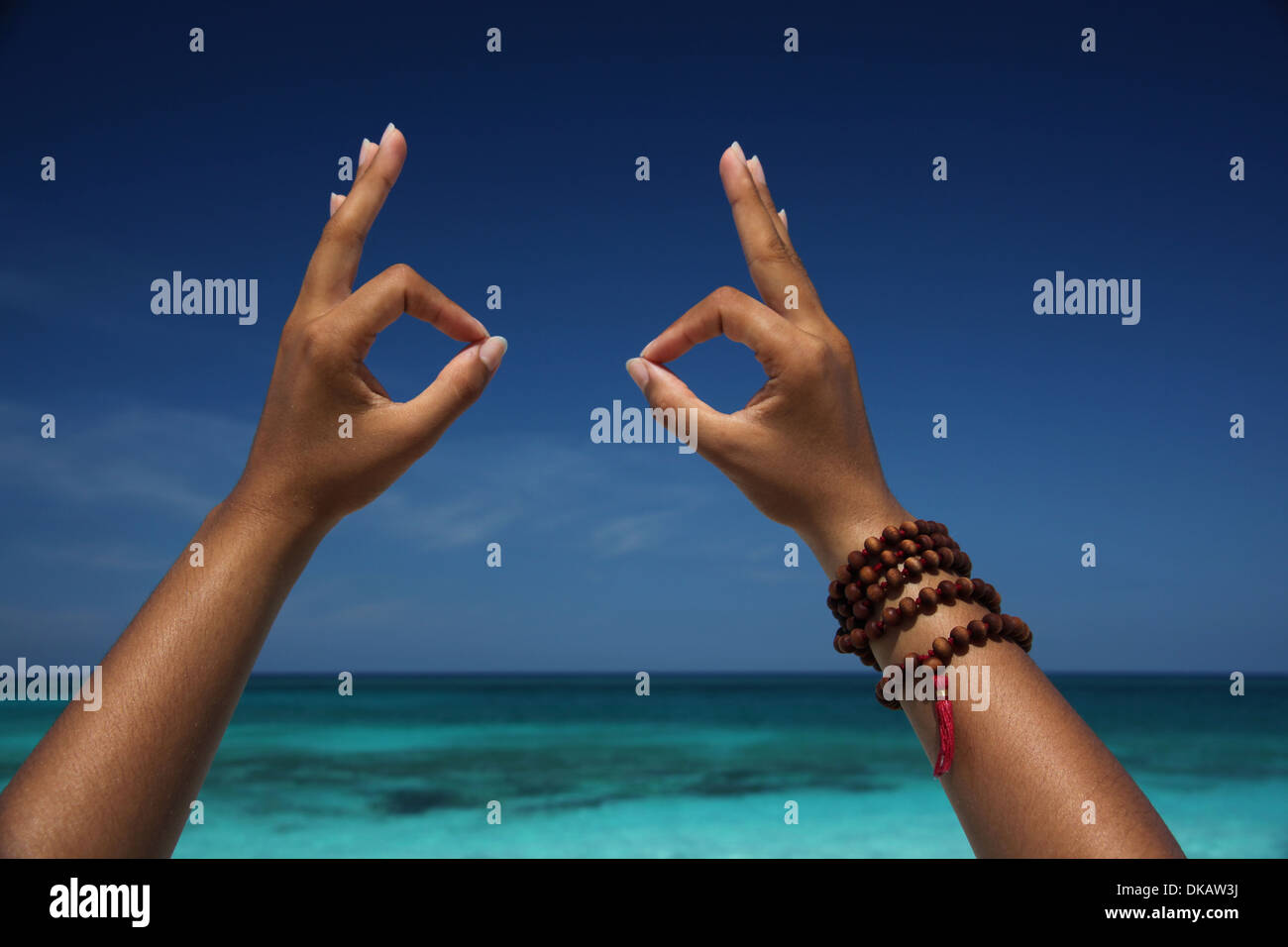 Close up of hands making gesture on beach, Paradise Island, Nassau ...