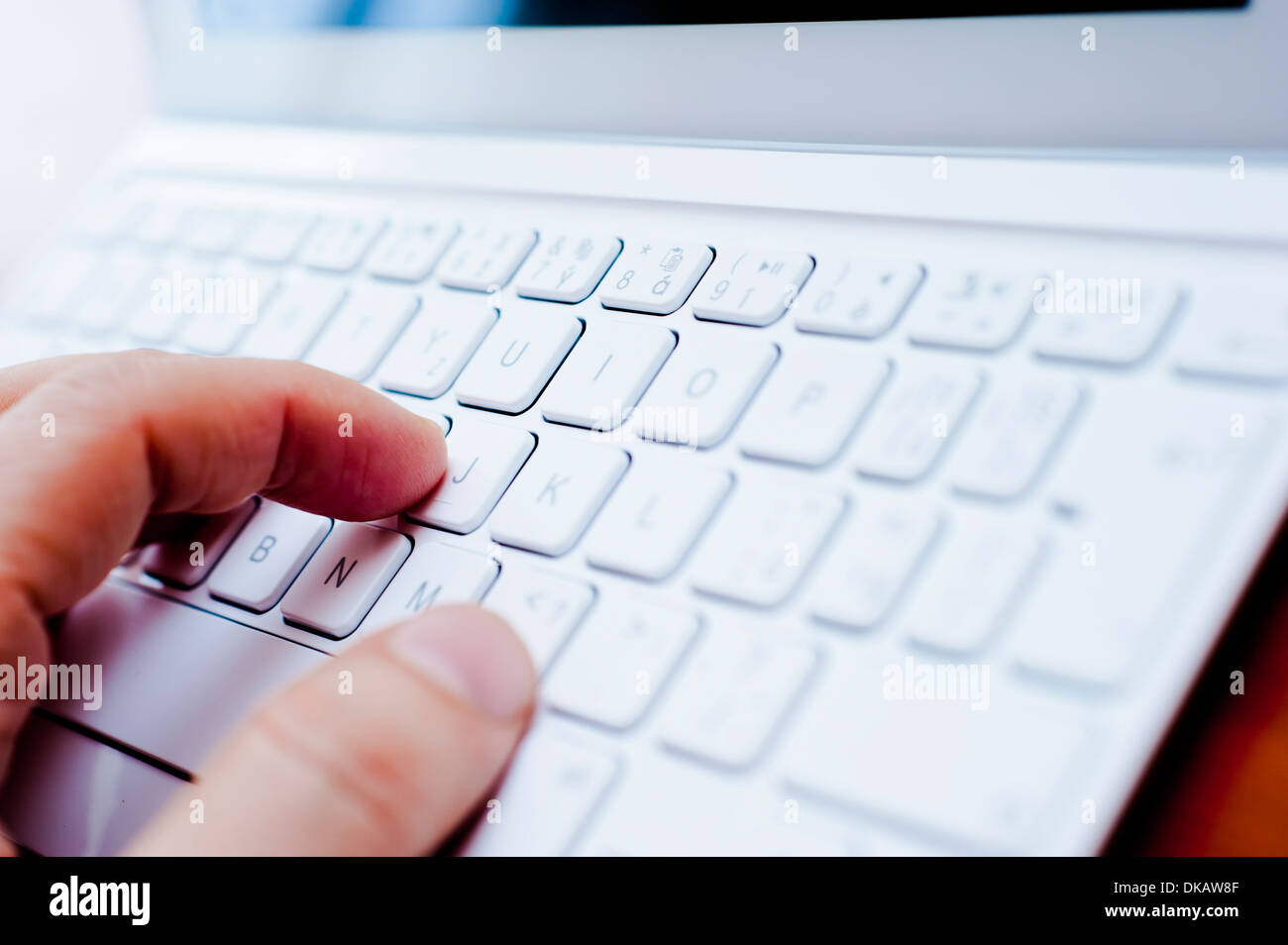 typing on a mini-keyboard Stock Photo - Alamy