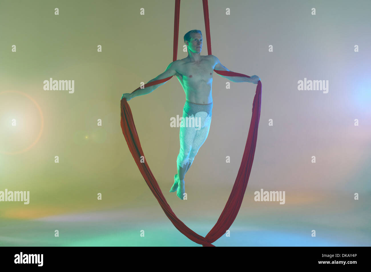 Aerial dancer with red ribbon Stock Photo - Alamy